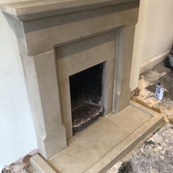 Hand carved Bath stone fireplace with kerb hearth edging